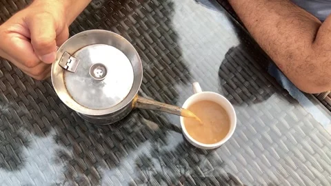 Pouring fresh milk tea. Typical Pakistan... | Stock Video | Pond5