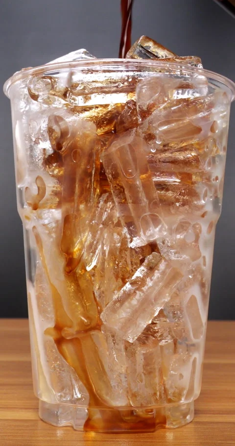 Pouring iced Americano coffee into trans... | Stock Video | Pond5