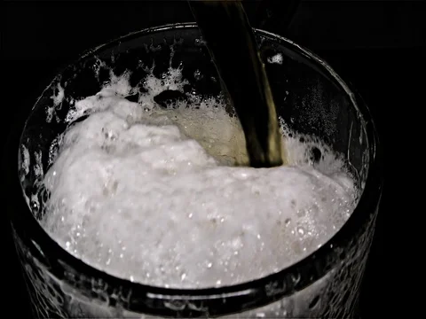 Pouring Light Beer and Foam - Close-Up, ... | Stock Video | Pond5