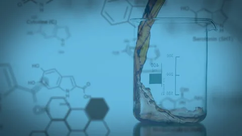 Pouring liquid into beaker over chemical... | Stock Video | Pond5