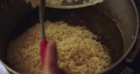 Pouring raw white rice with ladle into a... | Stock Video | Pond5