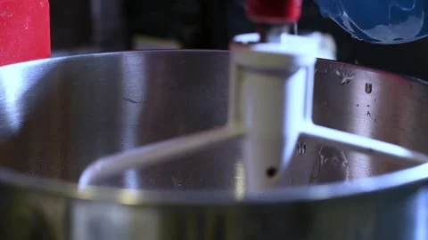 Pouring water into a stainless mixing bo... | Stock Video | Pond5