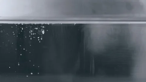 Pouring white powder in a glass of water | Stock Video | Pond5