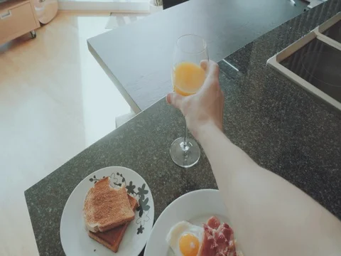 POV of a man eating breakfast in the kit... | Stock Video | Pond5