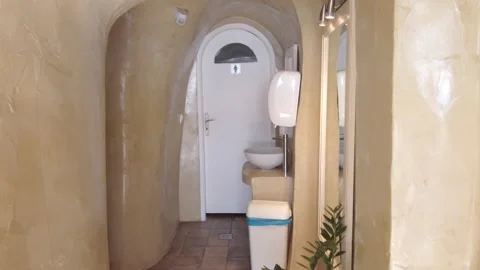 Pov open toilet door in Santorini Tradit... | Stock Video | Pond5