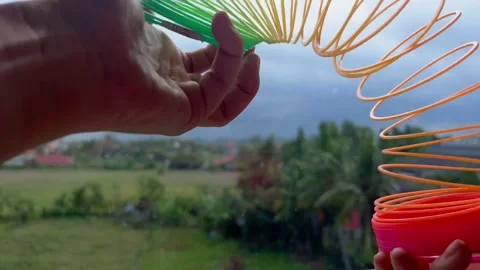 Slinky Fun Stock Video Footage | Royalty Free Slinky Fun Videos | Pond5