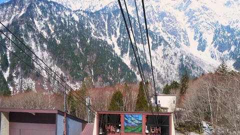 Pov riding on Shinhotaka Okuhida ropeway... | Stock Video | Pond5