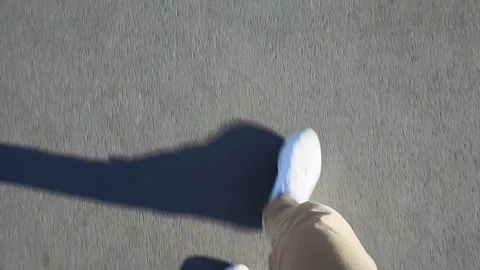 POV shot of a man's feet walking on the ... | Stock Video | Pond5