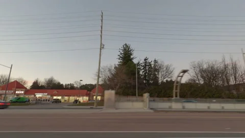 POV side view suburban area at dusk | Stock Video | Pond5