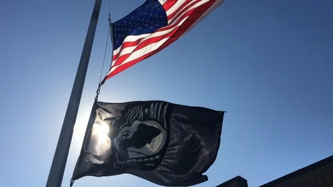 POW MIA Flag with American Flag Flying | Stock Video | Pond5