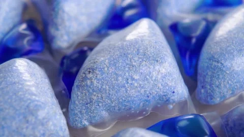 Powder and liquid blue detergent pods fo... | Stock Video | Pond5