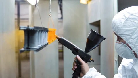 Powder coating of metal parts. A man in ... | Stock Video | Pond5