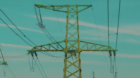 Power lines with sun rays on blue sky. H... | Stock Video | Pond5
