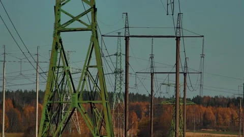 Power lines with sun rays on blue sky. H... | Stock Video | Pond5