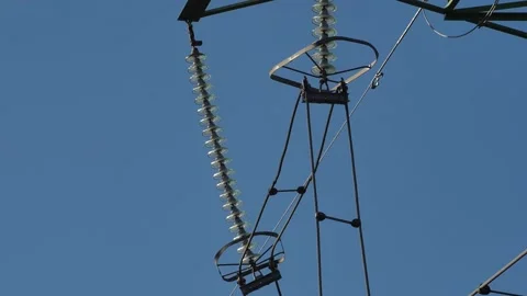 Power lines with sun rays on blue sky. H... | Stock Video | Pond5