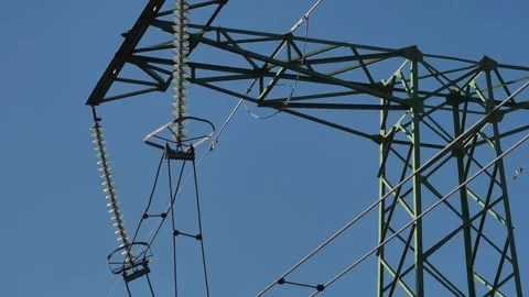 Power lines with sun rays on blue sky. H... | Stock Video | Pond5
