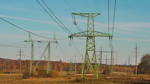 Power lines with sun rays on blue sky. H... | Stock Video | Pond5