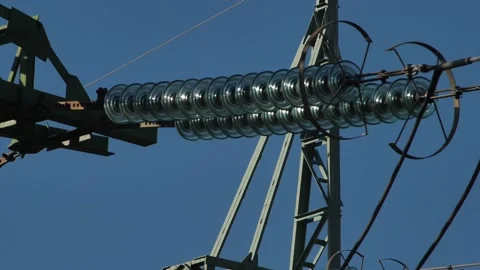 Power lines with sun rays on blue sky. H... | Stock Video | Pond5