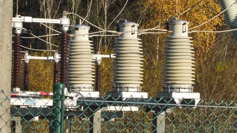Power lines with sun rays on blue sky. H... | Stock Video | Pond5