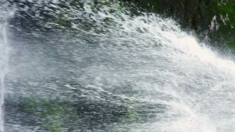 Powerful waterfall crashing down into a ... | Stock Video | Pond5