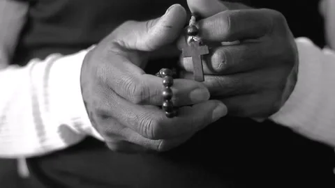 praying to god with cross in hands toget... | Stock Video | Pond5