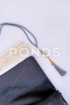 Praying mat top view white background. Islamic shop items Stock Photo ...