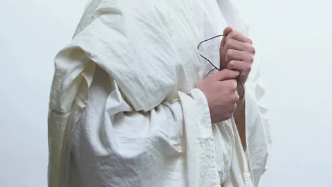Preacher in white robe holding wooden cr... | Stock Video | Pond5