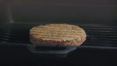 Preparing the fast food burger patty ing... | Stock Video | Pond5
