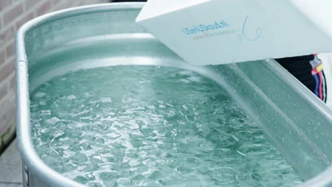 Preparing Ice Bath Tub With Ice Cubes. I... | Stock Video | Pond5