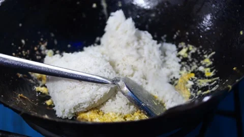 Preparing Indonesian fried rice in a wok... | Stock Video | Pond5