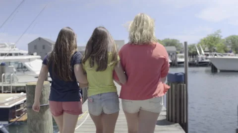 Preppy Teen Girls Walk Arm In Arm Down D... | Stock Video | Pond5