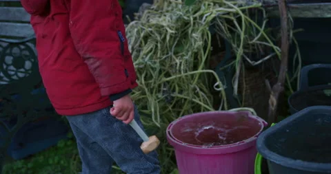 Preschooler using toy hammer to break ic... | Stock Video | Pond5
