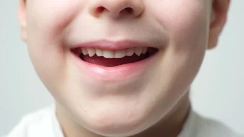 A preschooler's smile, close-up lips. Ba... | Stock Video | Pond5