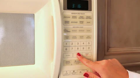 pressing numbers on microwave | Stock Video | Pond5