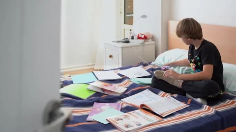 Preteen child doing homework exercise si... | Stock Video | Pond5