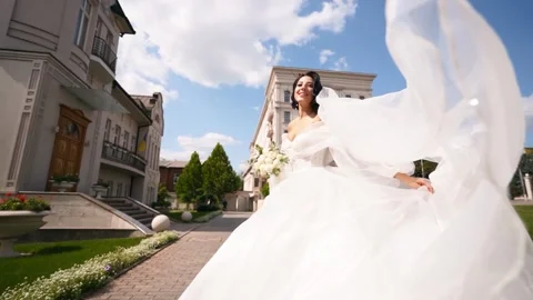 Pretty bride in long airy veil, elegant ... | Stock Video | Pond5