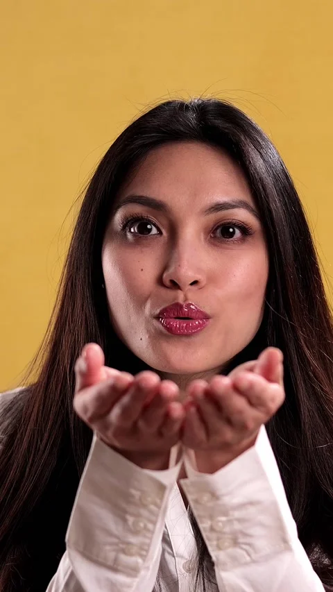 Pretty girl sending a kiss to the camera | Stock Video | Pond5