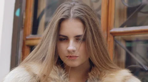 Pretty girl seriously looking on the cam... | Stock Video | Pond5