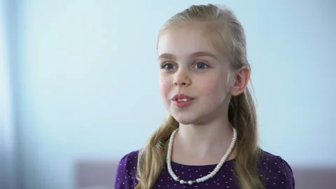 Pretty little girl with pearl necklace l... | Stock Video | Pond5
