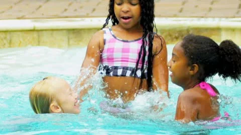 Pretty Multi Ethnic Children Playing Swi... | Stock Video | Pond5