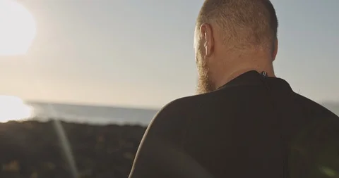 Pretty smiling man turning face to camer... | Stock Video | Pond5