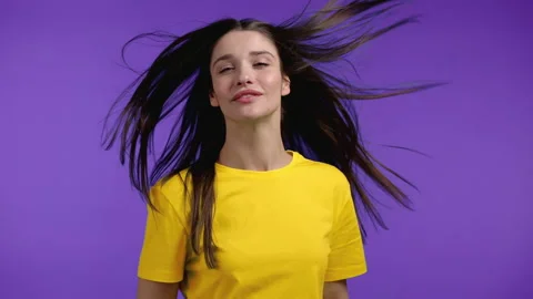 Pretty woman dancing on violet studio ba... | Stock Video | Pond5