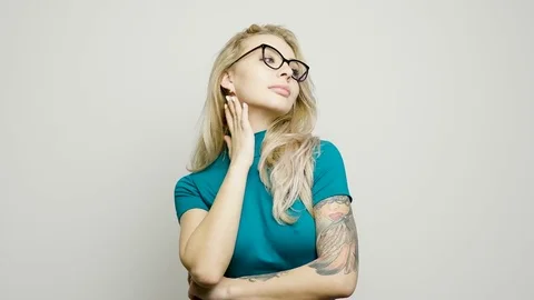 Pretty young woman making silly faces at... | Stock Video | Pond5