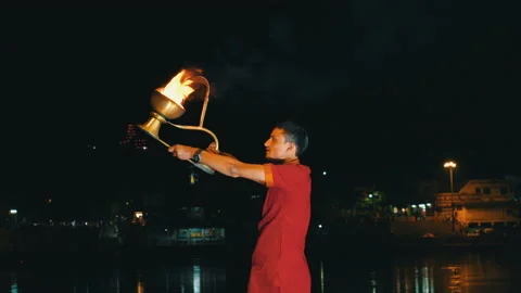 Priest doing aarti at Ganga Ghat, Uttara... | Stock Video | Pond5