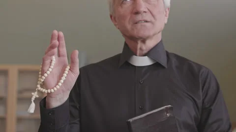 Priest Preaching Sermon at Home | Stock Video | Pond5