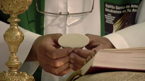 Priest Raising Host during Holy Communio... | Stock Video | Pond5