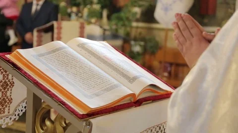 Priest reading the Bible in church | Stock Video | Pond5