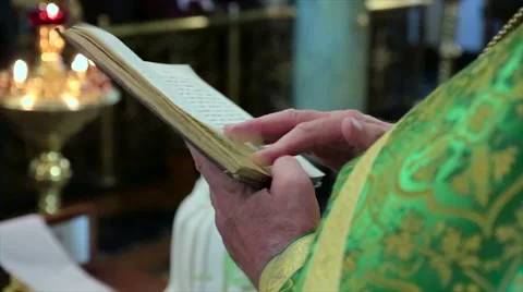 Priest reading the Bible in church. prie... | Stock Video | Pond5