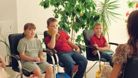 Primary school children talk to teacher ... | Stock Video | Pond5