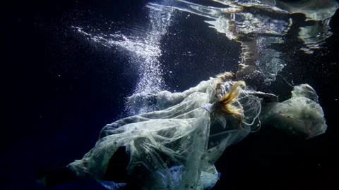 princess sinking in water, underwater sl... | Stock Video | Pond5